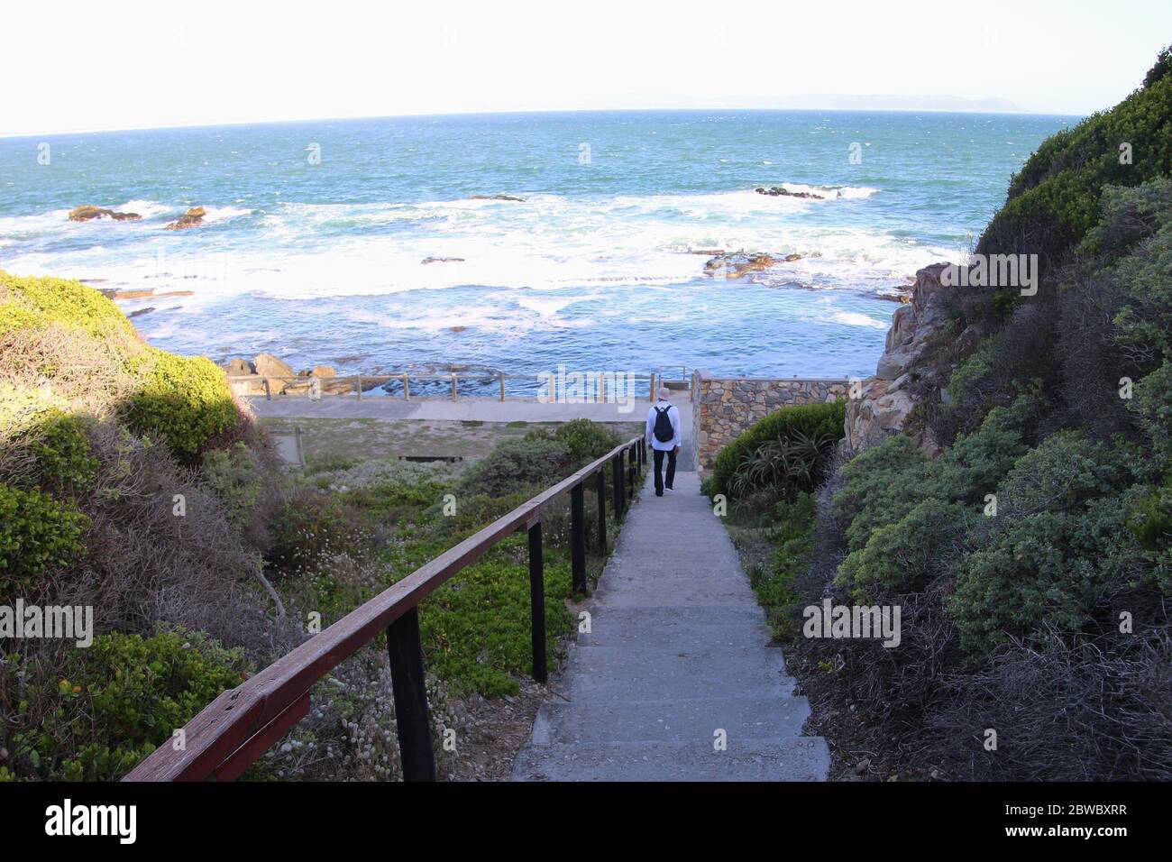 On the coast of Hermanus, South Africa. View of the wild Indian Ocean ...