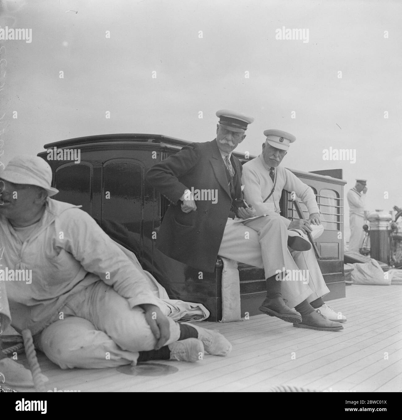 The King takes the wheel of his yacht Britannia . The Duke of Connaught ...