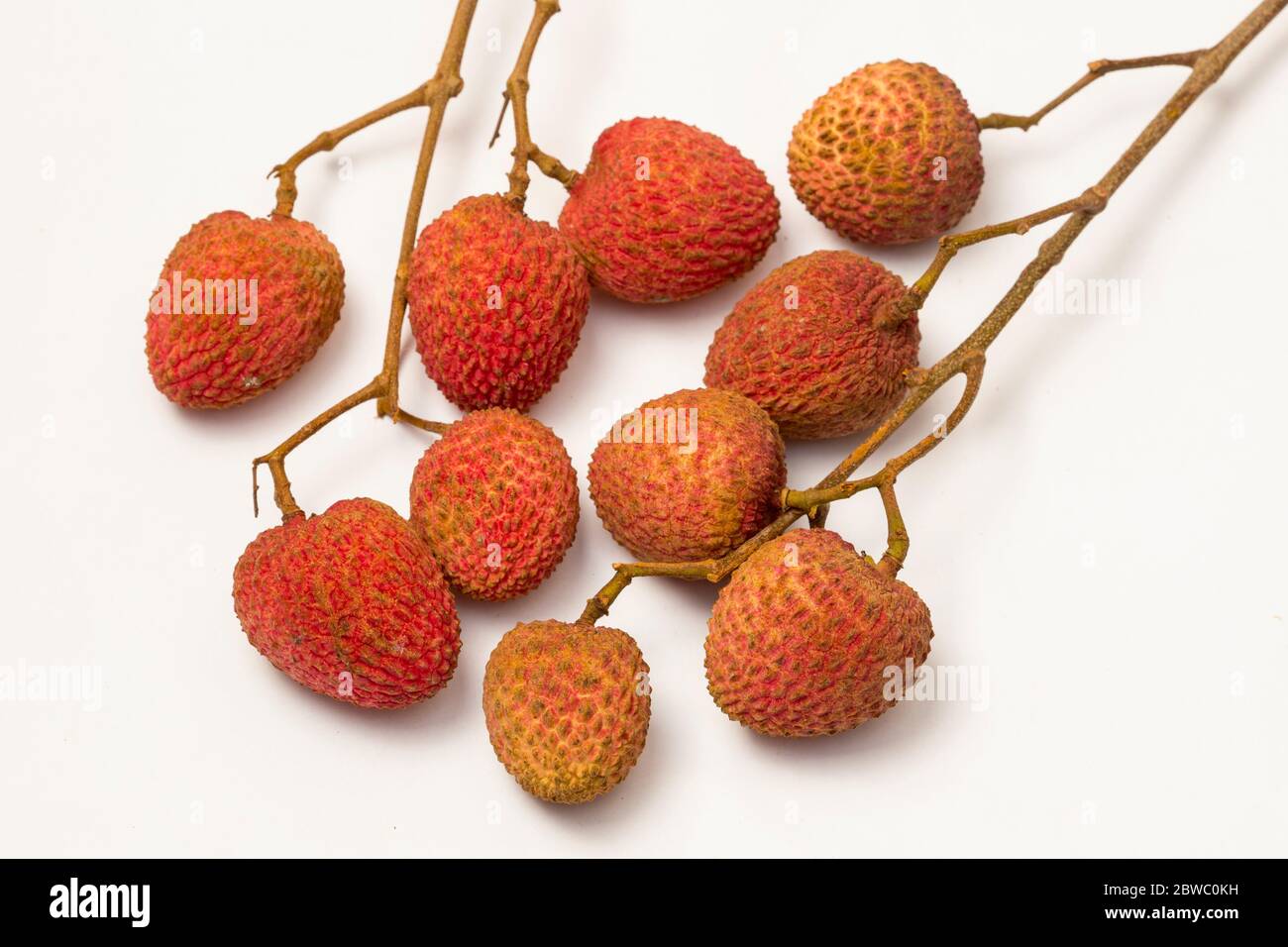 Close-up view of ripe lychee on white background Stock Photo - Alamy
