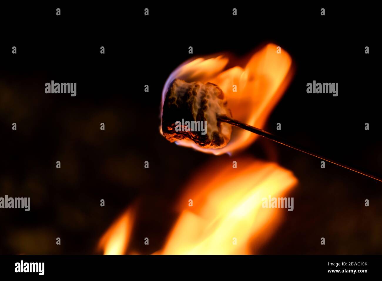 Burning marshmallow on stick hi-res stock photography and images - Alamy