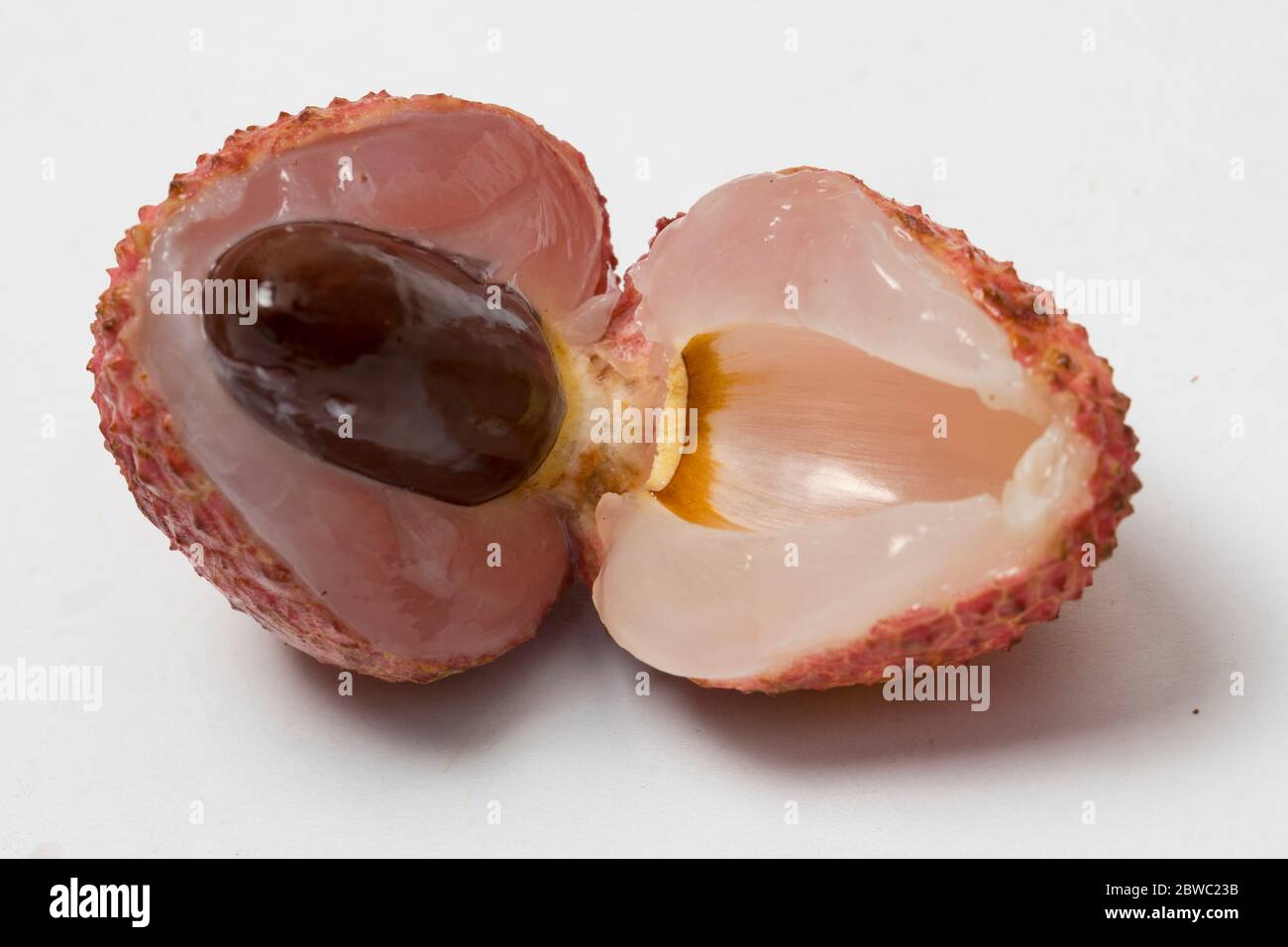 Close-up view of ripe lychee on white background Stock Photo - Alamy