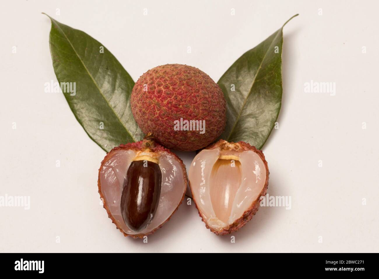 Close-up view of ripe lychee on white background Stock Photo - Alamy