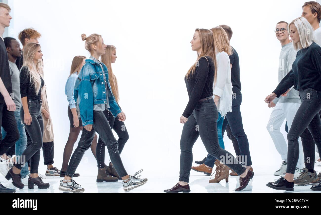 casual young people walking in different directions Stock Photo - Alamy