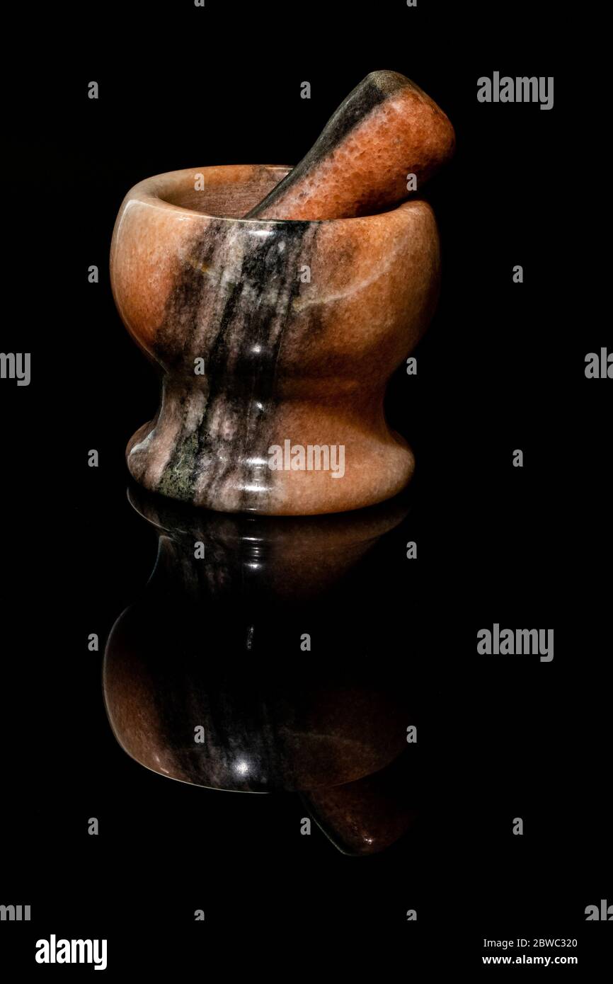 A mortar on black background with reflection Stock Photo - Alamy