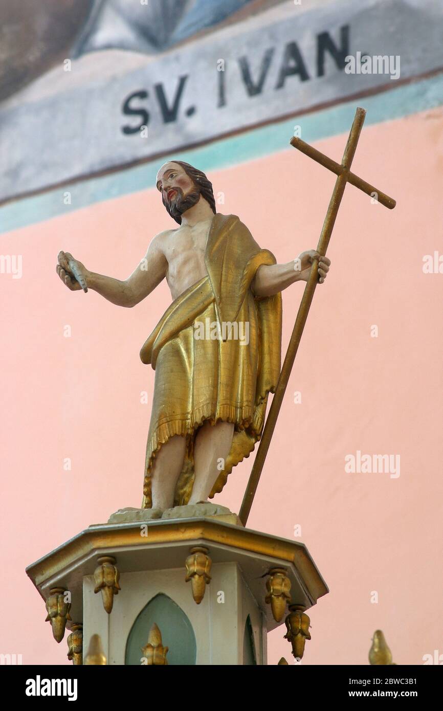 Saint John the Baptist, statue at the baptistery in the parish church ...