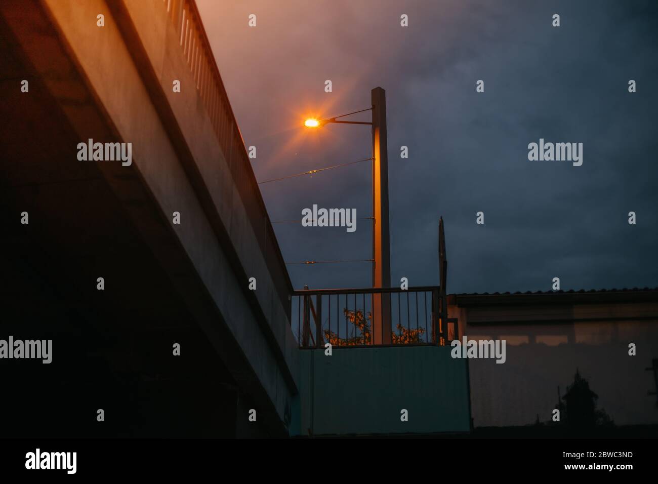 single street light at night at bridge Stock Photo - Alamy