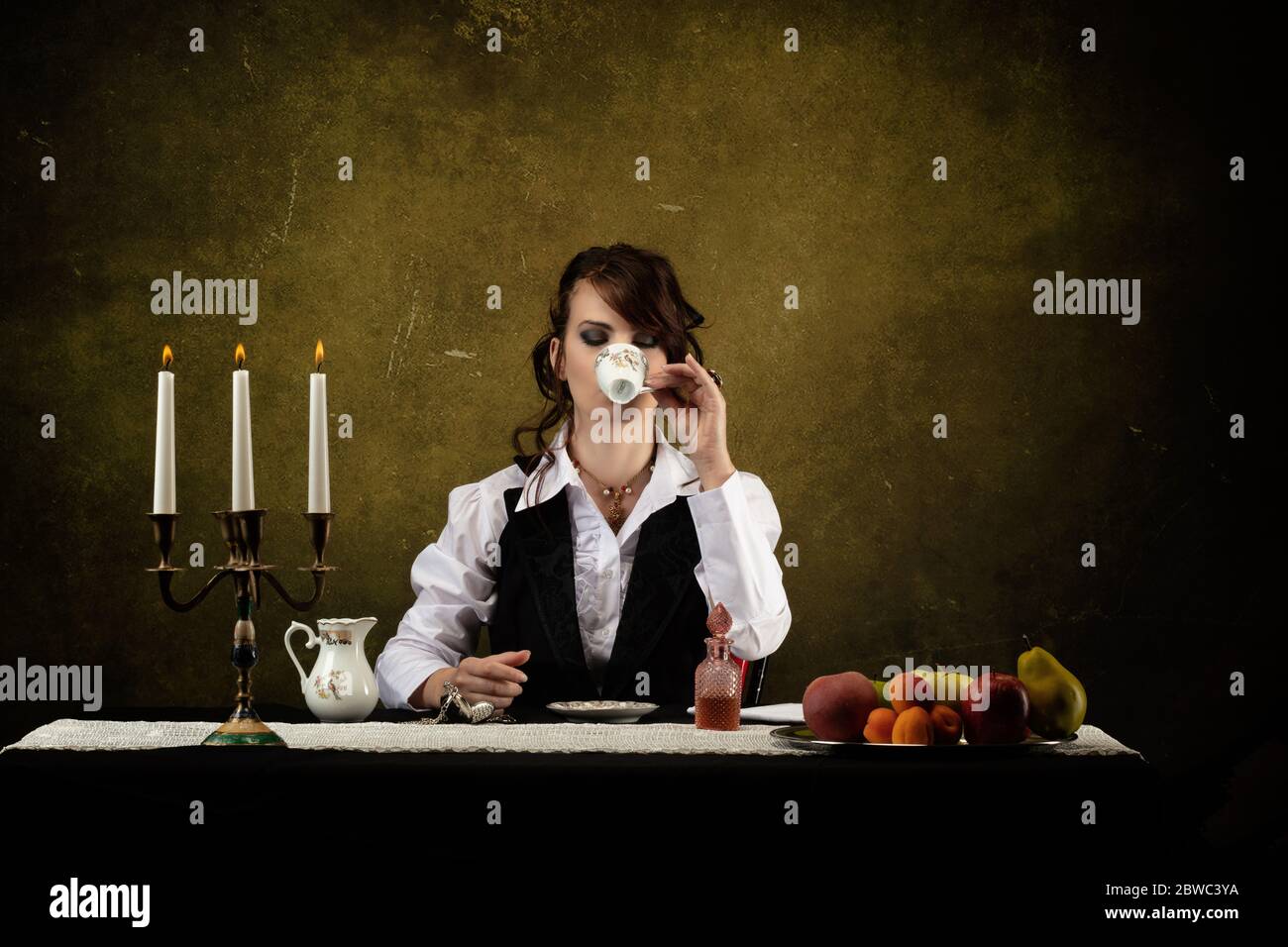 Portrait of a young Victorian woman drinking a cup of tea Stock Photo ...