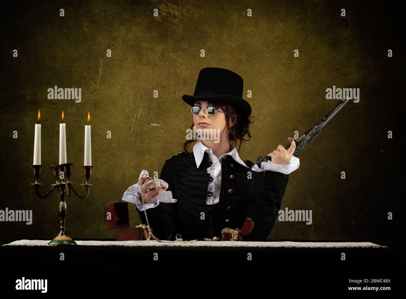 Portrait of a young Victorian woman wearing a top hat, black glasses ...