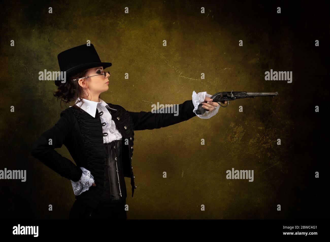 Portrait of a young Victorian woman wearing a top hat, black glasses ...