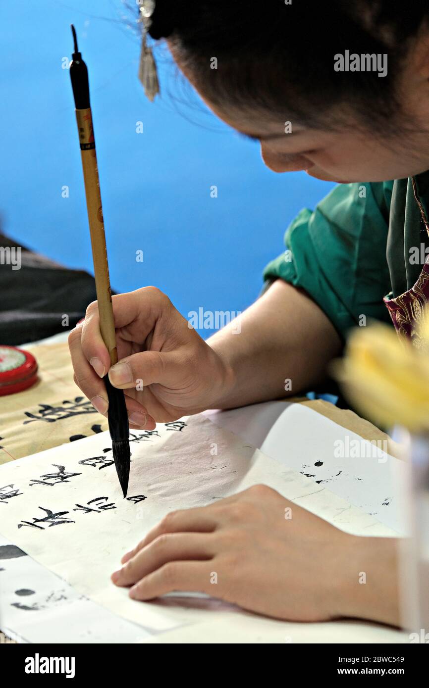 young girl performs calligraphy exercises Stock Photo - Alamy