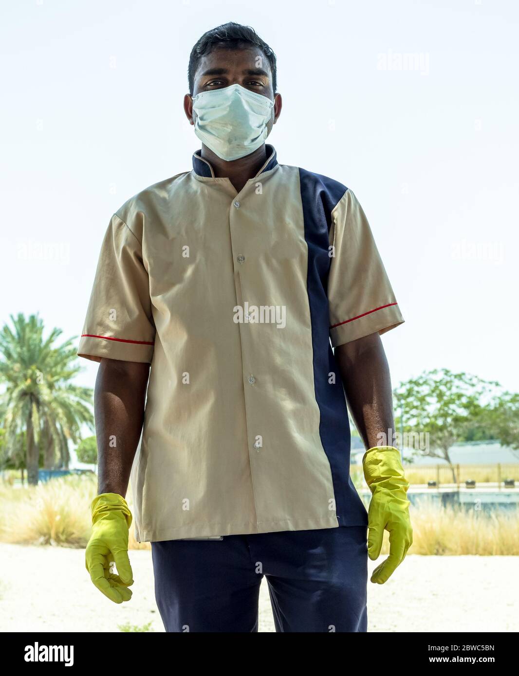 an indian garden man employee in sheikh zayed grand mosque, wearing ...