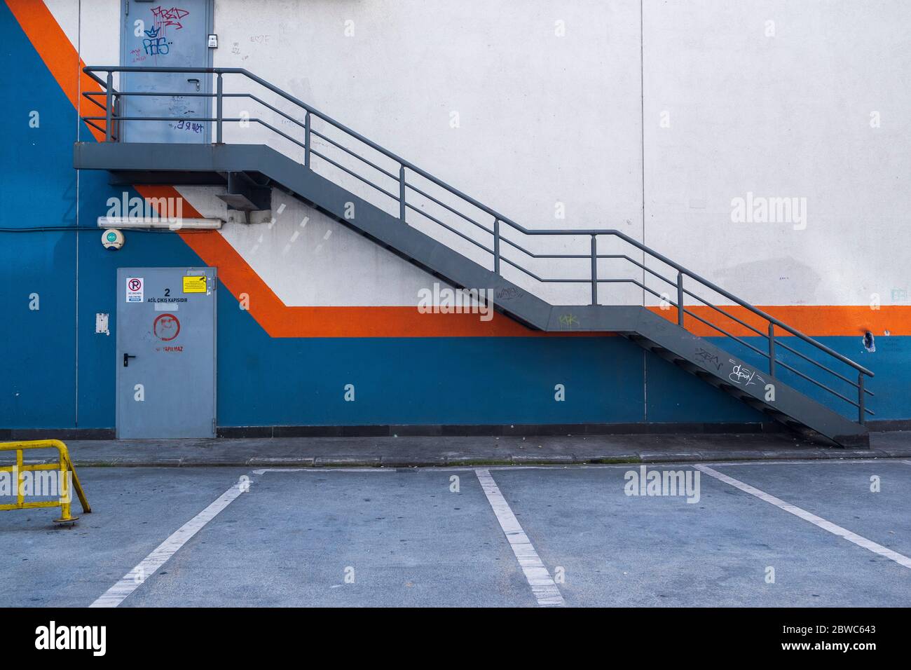 gray metal fire escape stairs on a building Stock Photo - Alamy