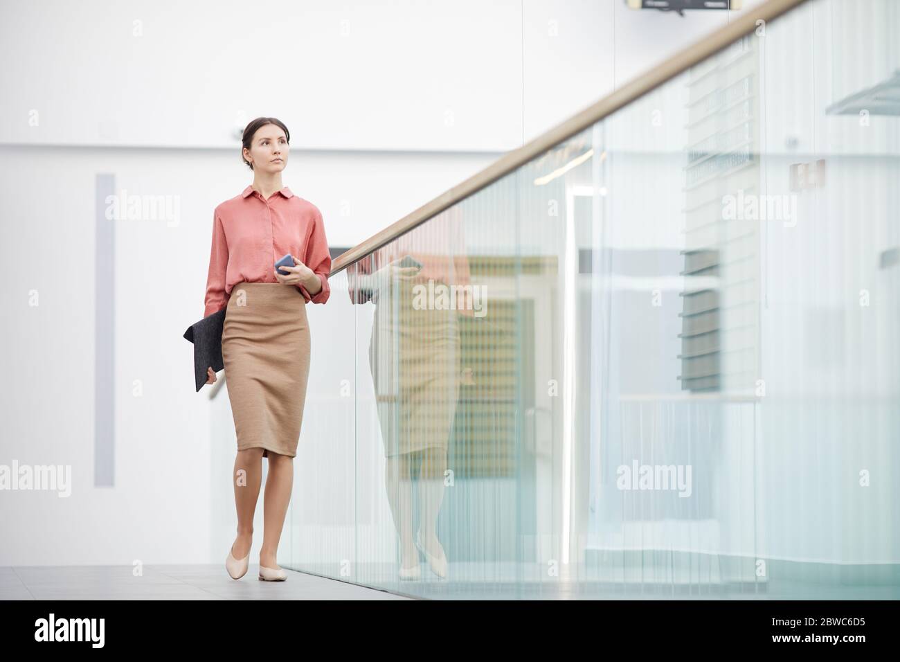 Business person walking towards camera hi-res stock photography and ...