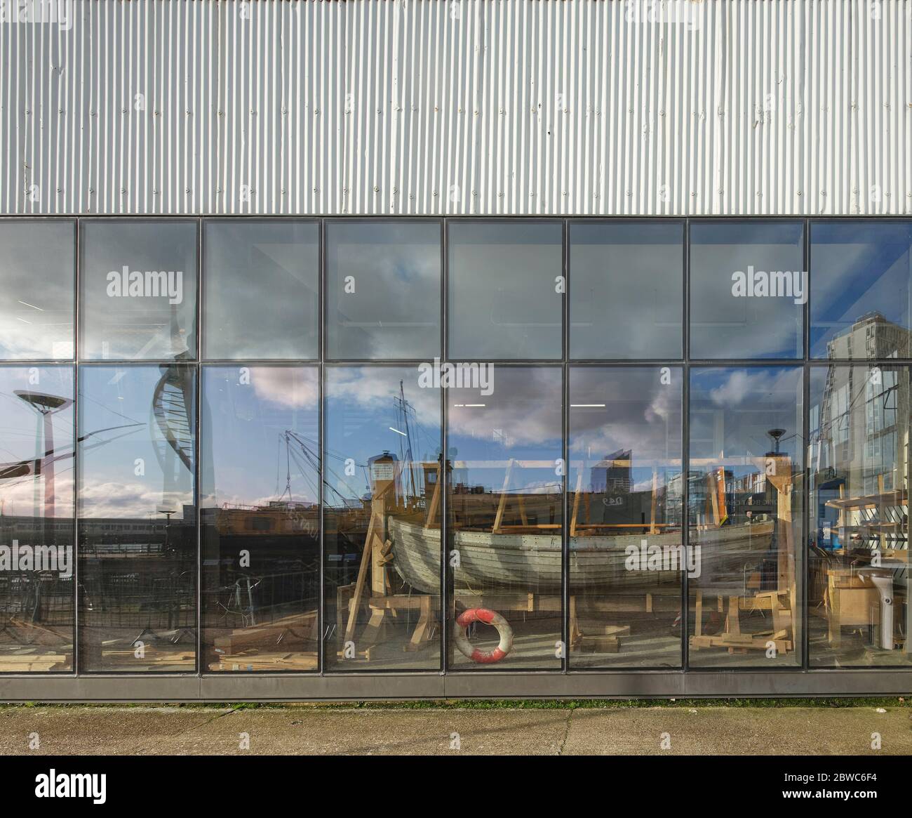 Workshop window with reflection and corrugated cladding. Boathouse 4 ...