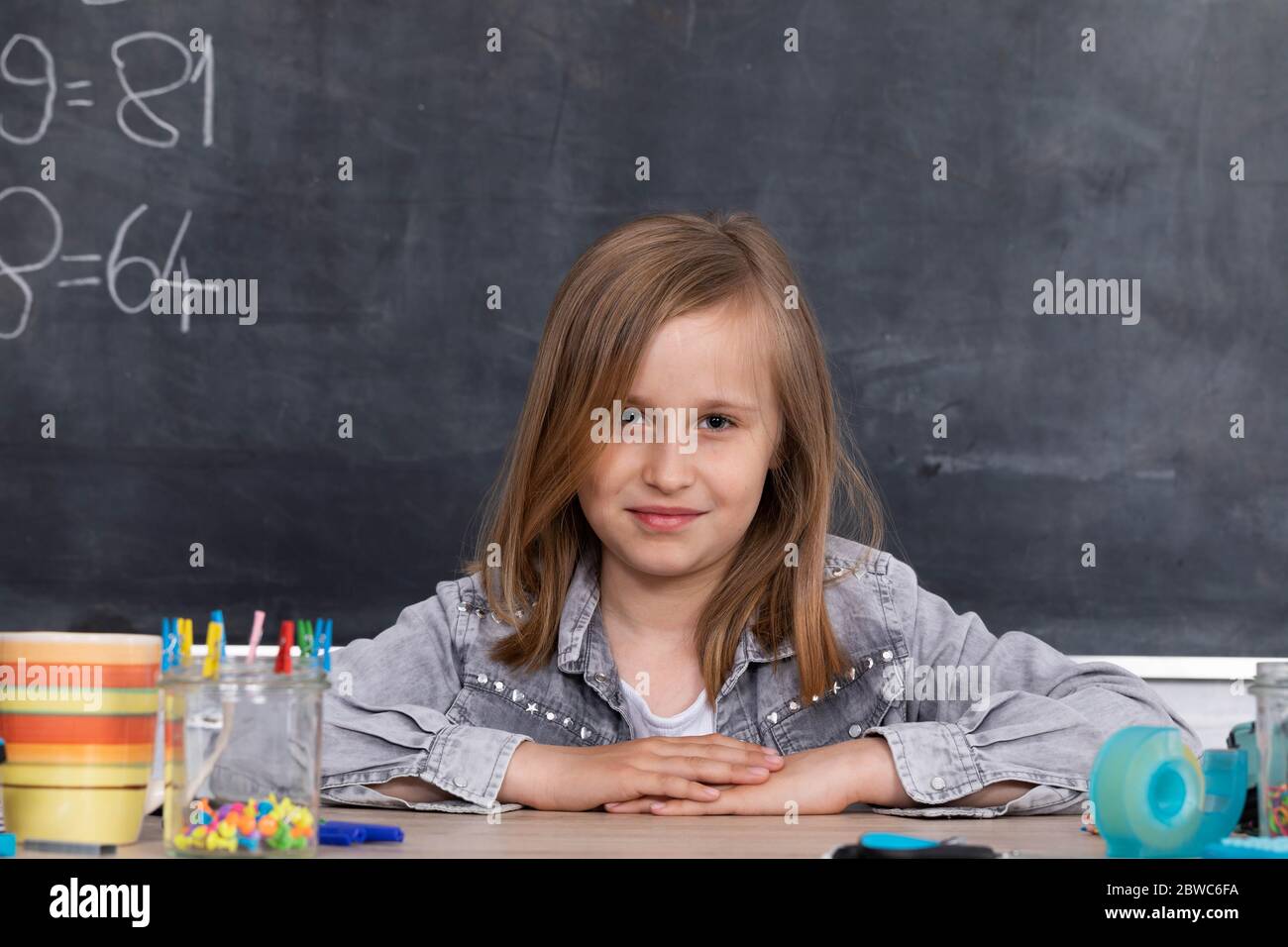 Exemplary schoolgirl. Correct posture while sitting in the classroom ...