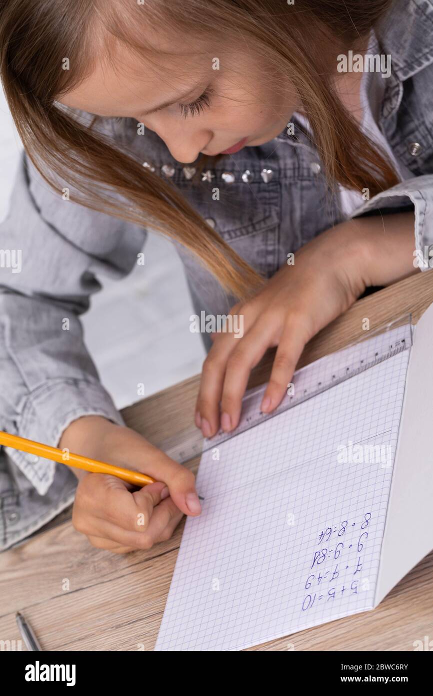 The student uses a ruler and pencil to draw lines that are the solution ...