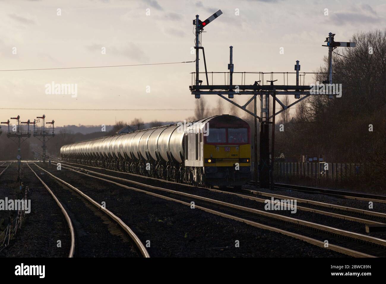 DB Cargo class 60 diesel locomotive hauling a long freight train of oil ...