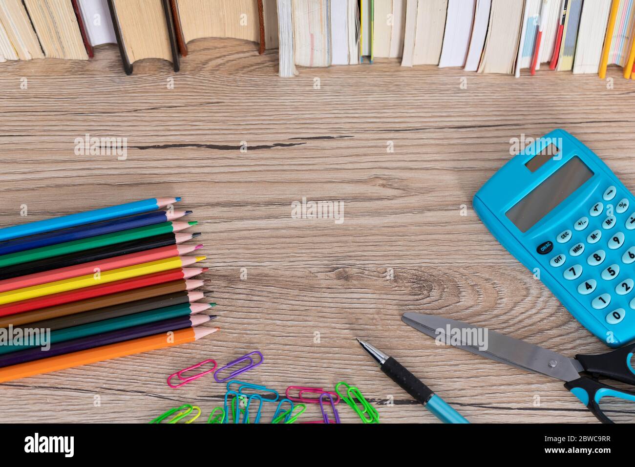 New school supplies. Books arranged in a row. Equipment for every ...
