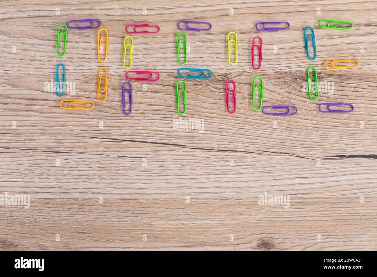 Wooden desk top. Board structure. Paperclip Inscription - office Stock ...