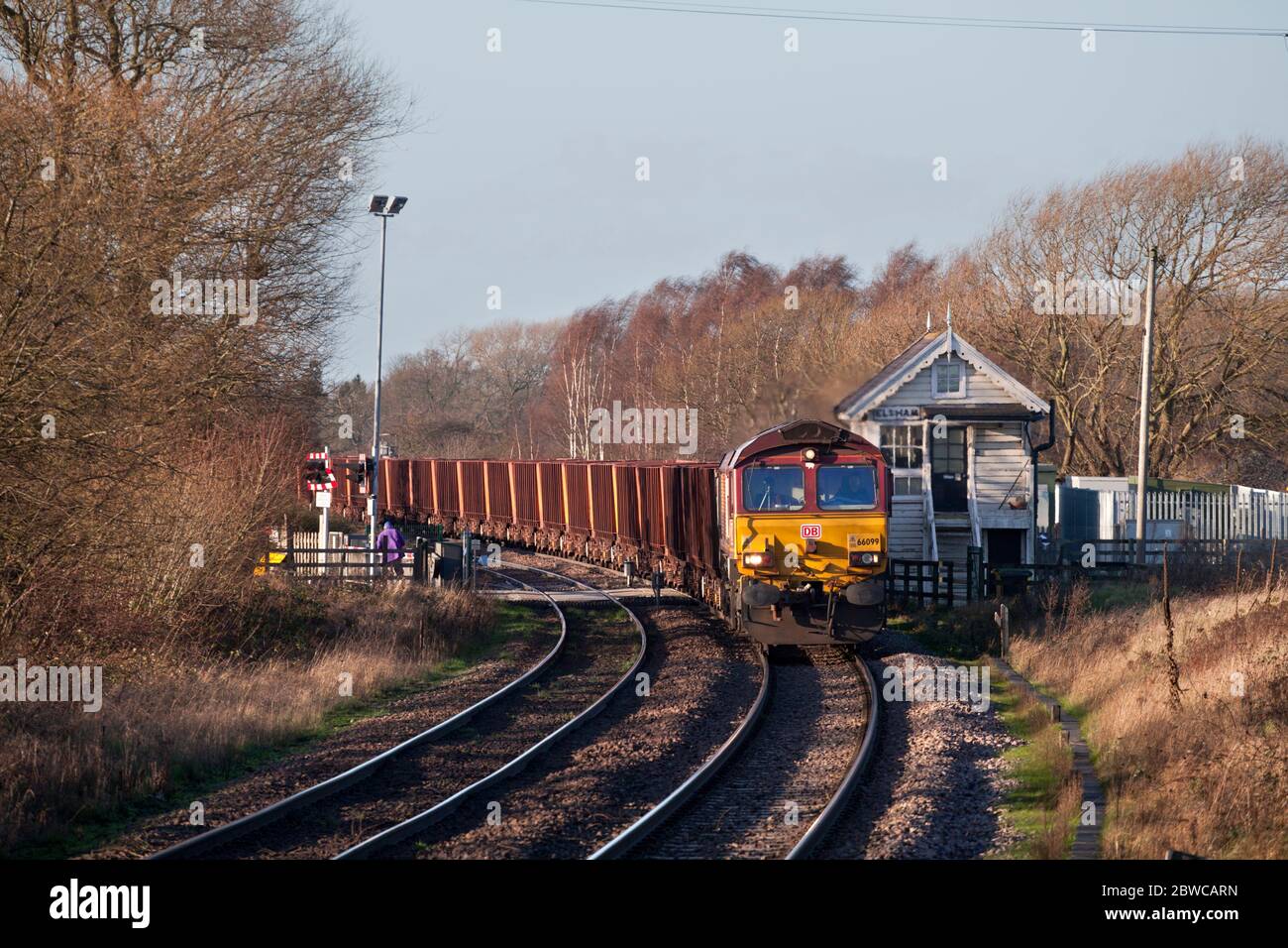DB Cargo rail class 66 locomotive 66099 passing Elsham signal box with ...