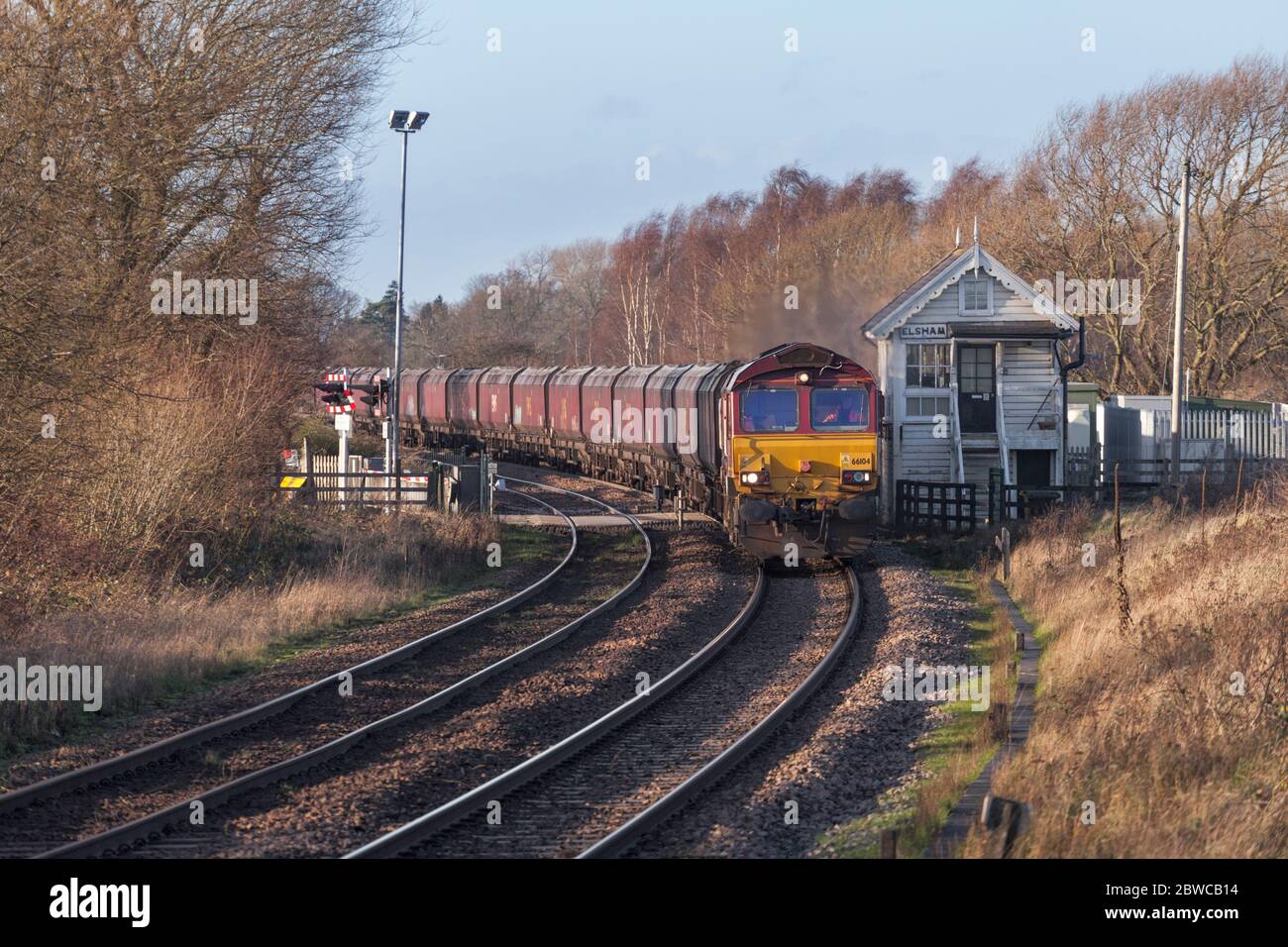 DB Cargo rail class 66 locomotive 66104 passing the timber Elsham ...