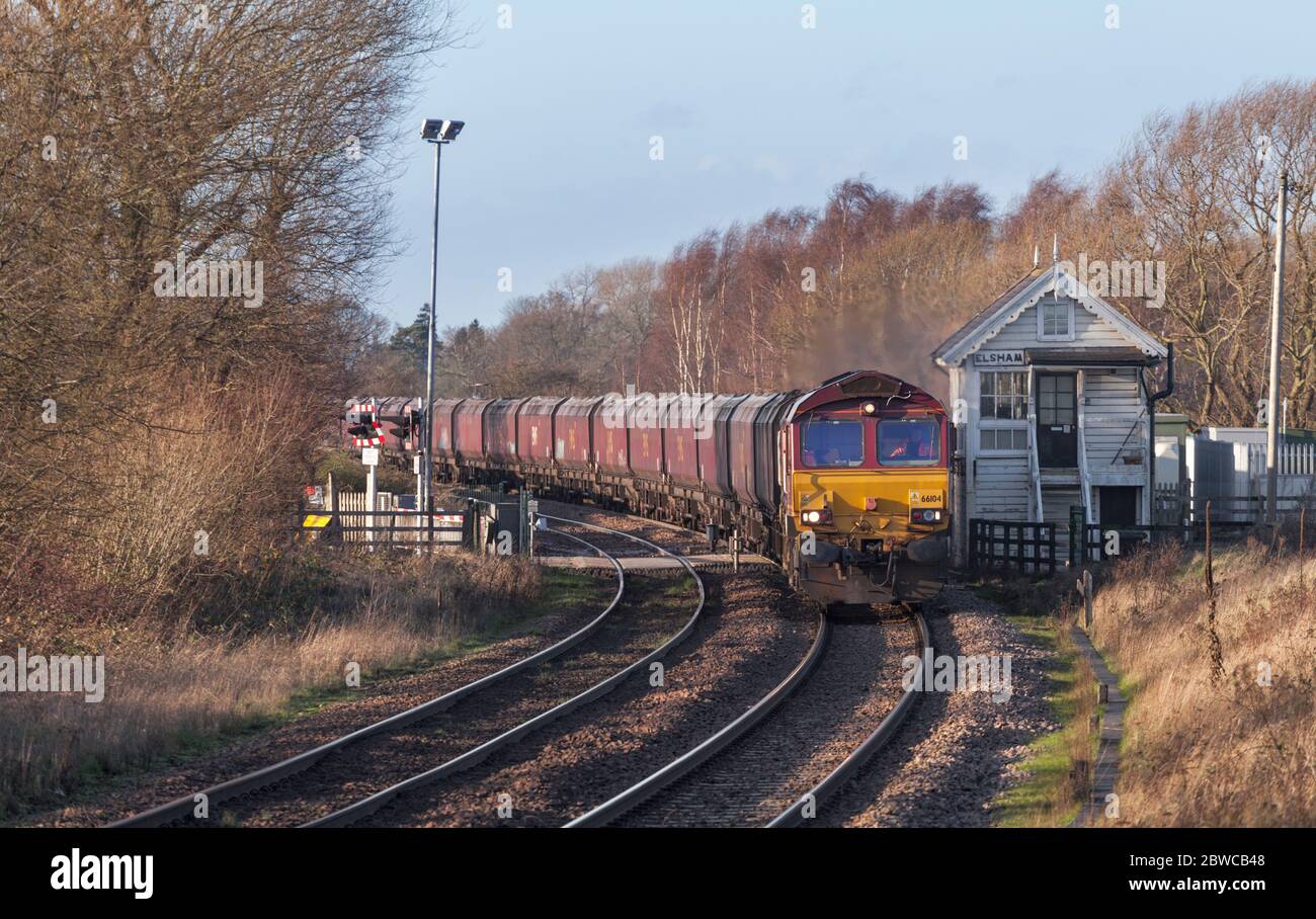 DB Cargo rail class 66 locomotive 66104 passing the timber Elsham ...