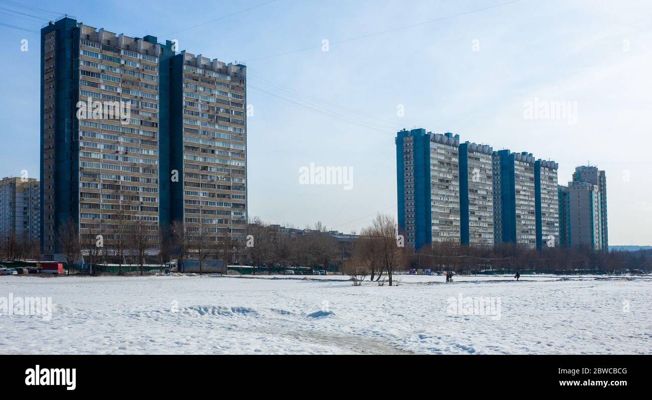 Winter landscape. Grey-blue multi-storey residential buildings in the ...