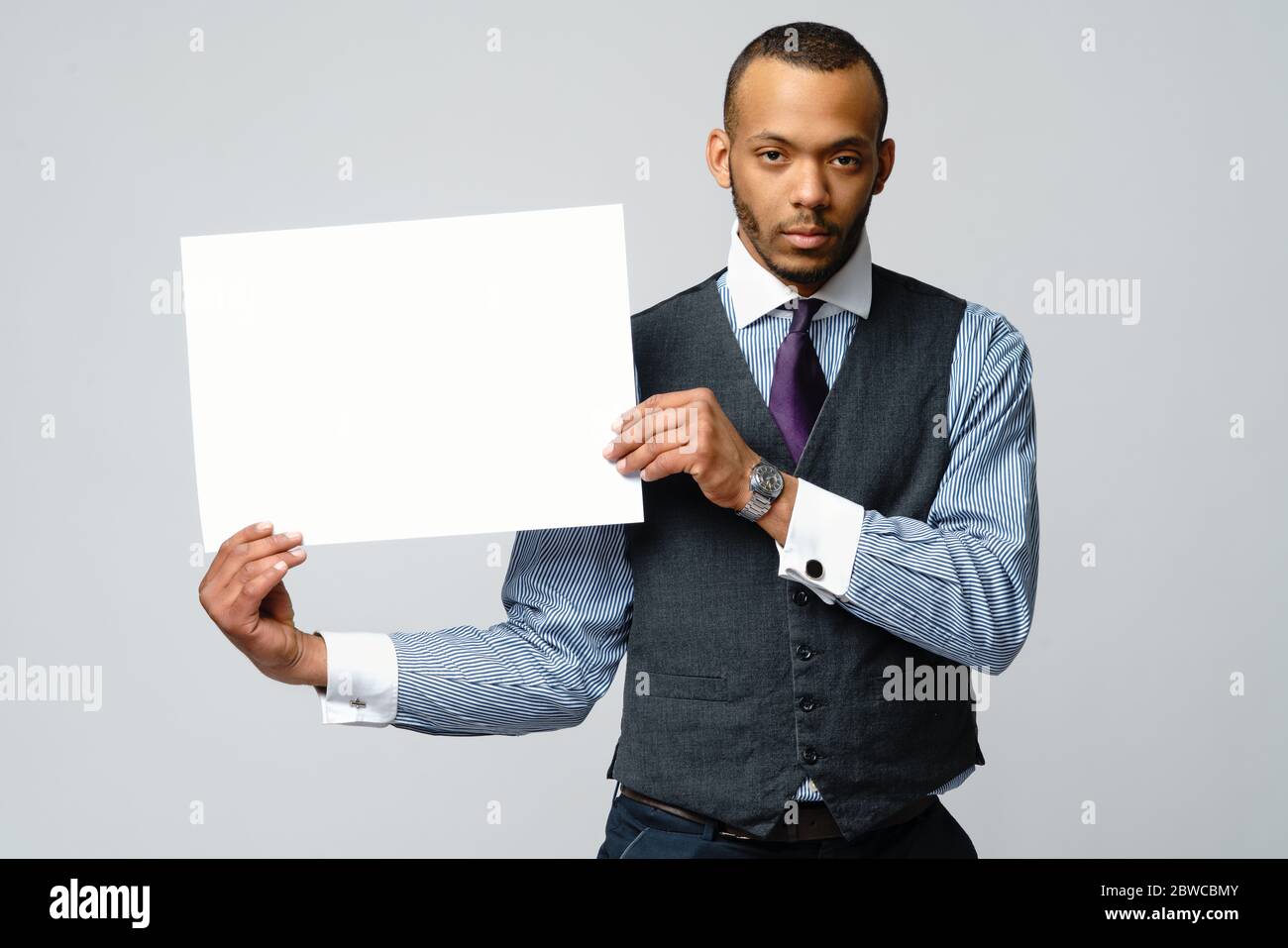 professional african-american business man - presenting holding blank ...