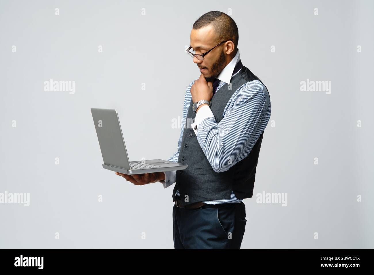 professional african-american business man holding laptop computer ...