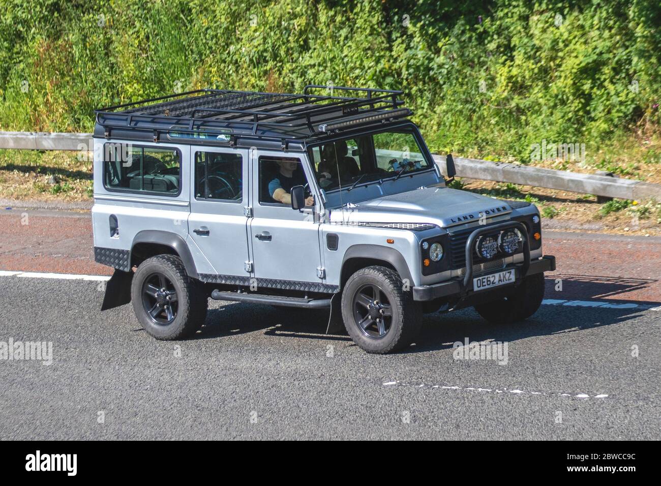 2012 silver Land Rover Defender 110 TD D/C: Vehicular traffic moving ...