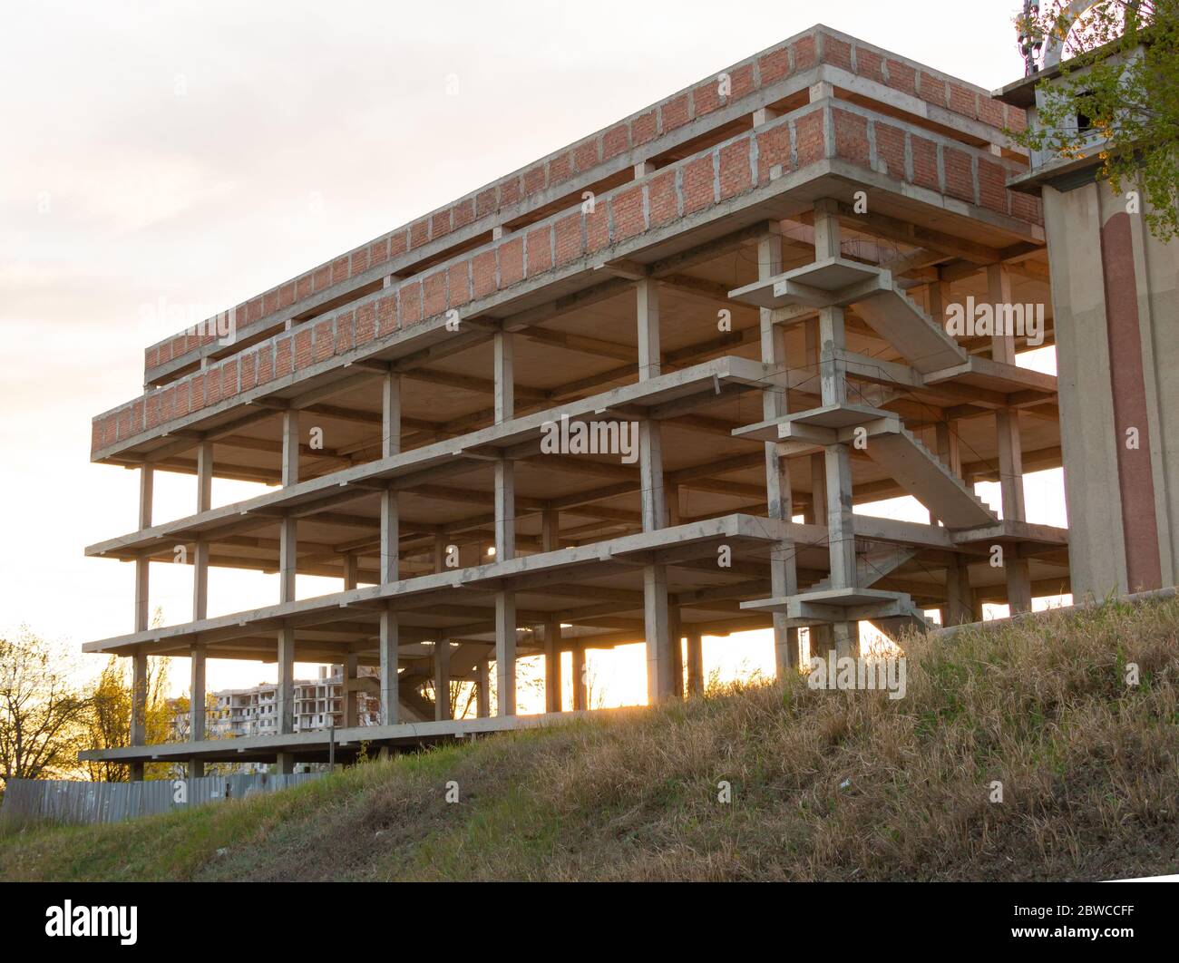 Building under construction with 4 floors at sunset Stock Photo - Alamy