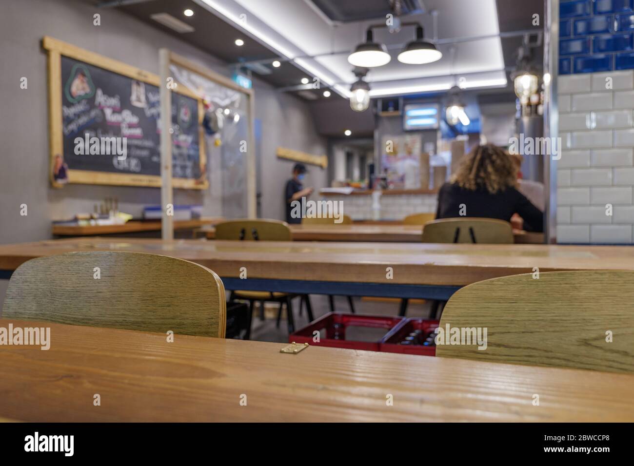 Temporary transparent plastic partition set up on wooden frame to ...