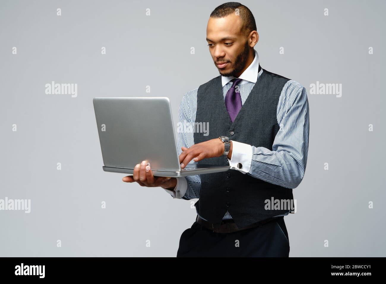 professional african-american business man holding laptop computer ...