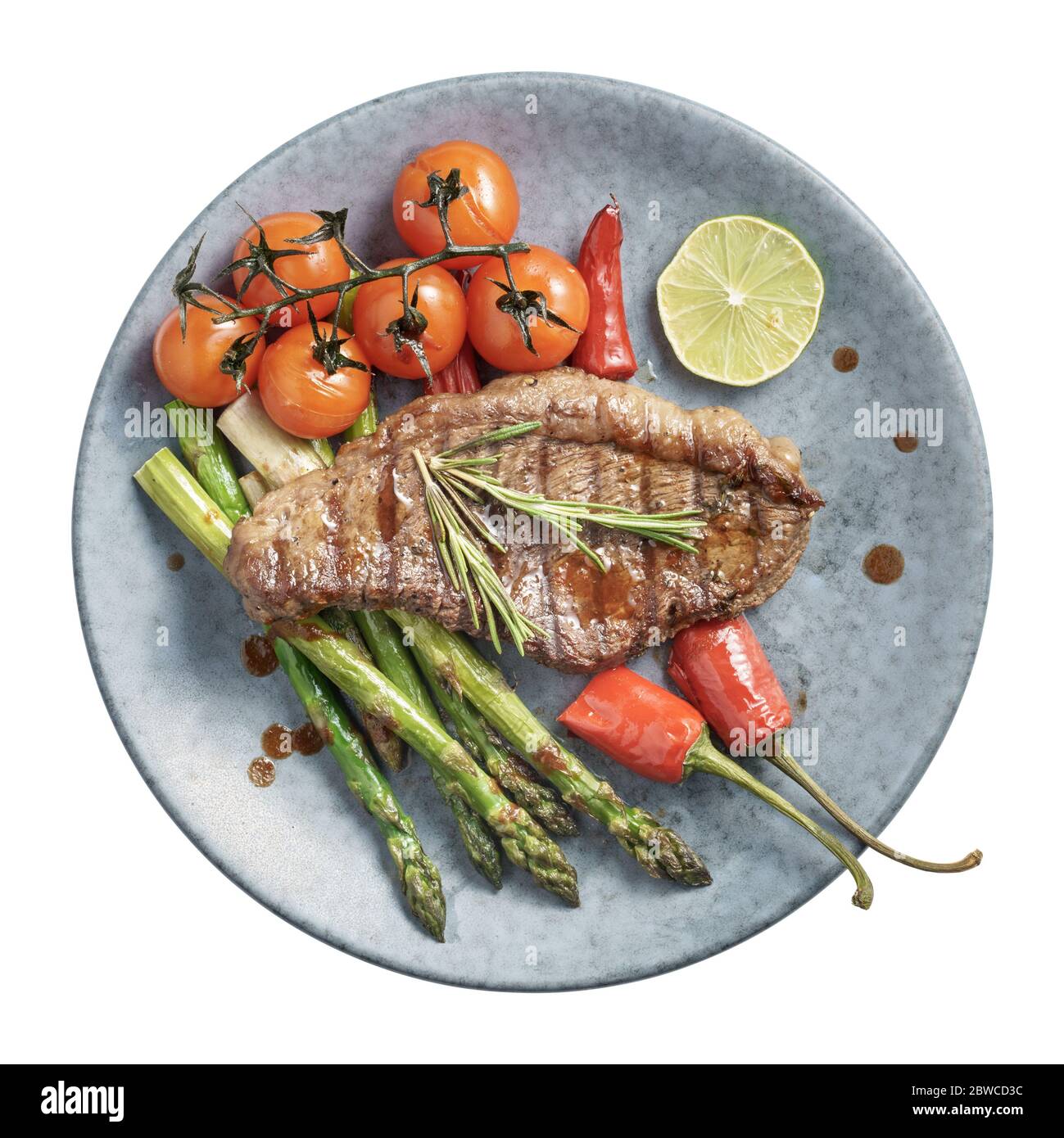 Beef steak with asparagus isolated Stock Photo - Alamy