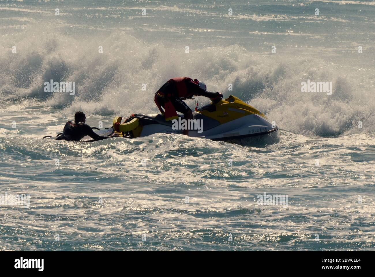 RNLI lifeguards rescue surfers at fistral beach one day after resuming ...