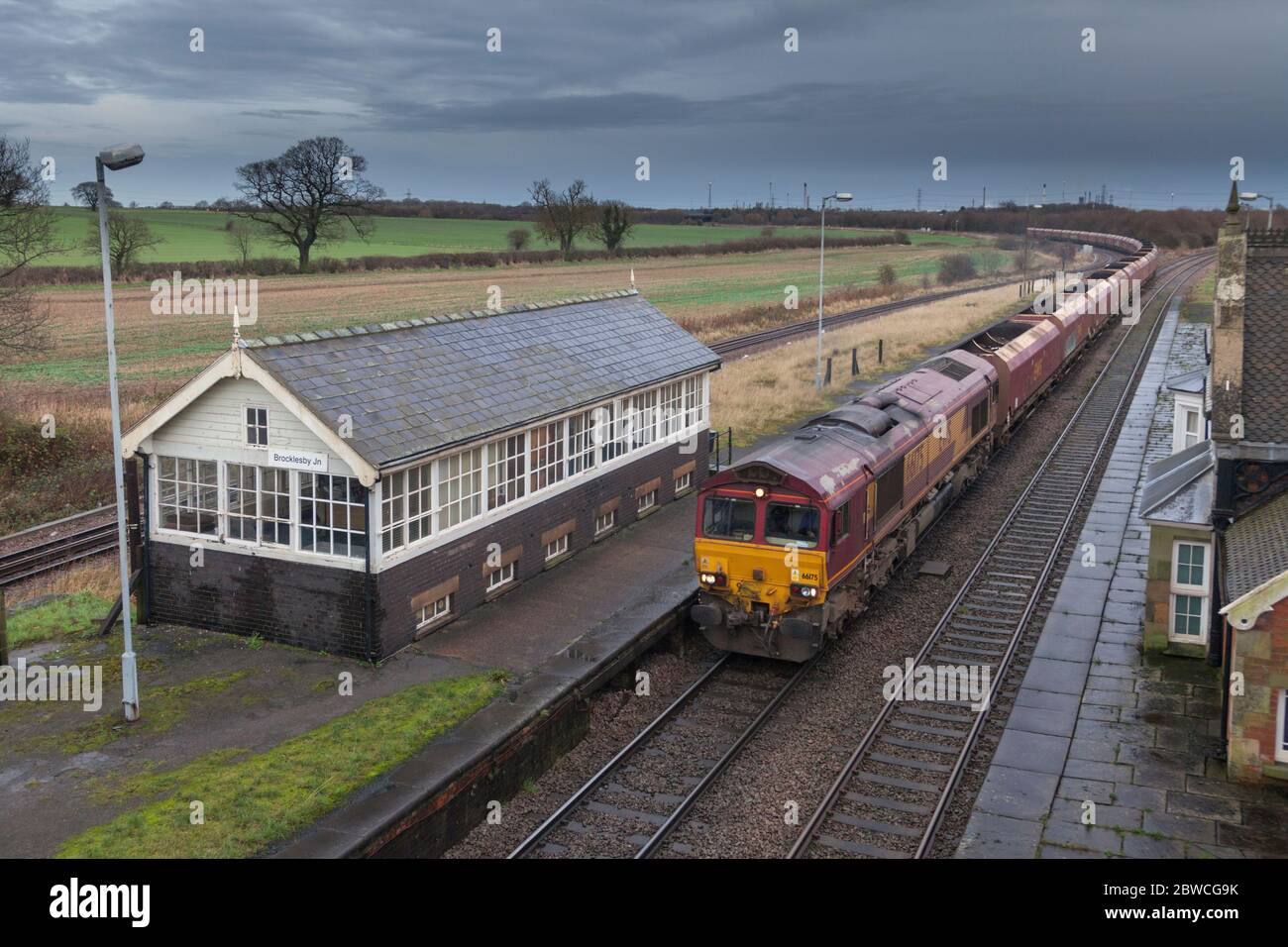 DB cargo class 66 locomotive 66175 passing the signal box on the closed ...