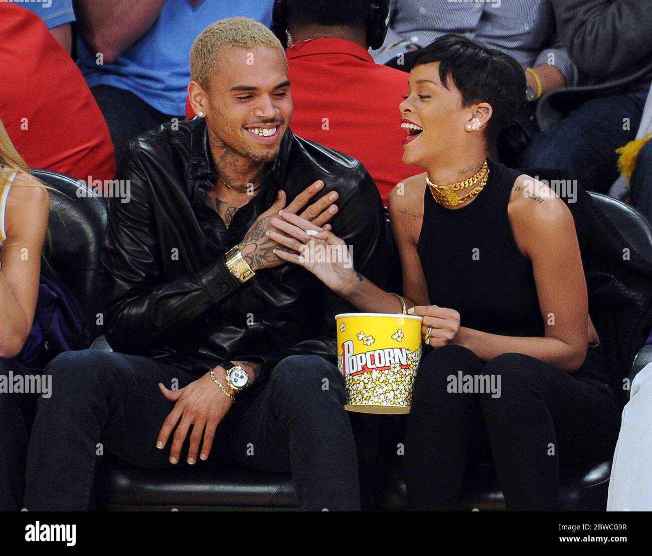 Rihanna, Chris Brown laughing together at LA Lakers NBA game, December ...