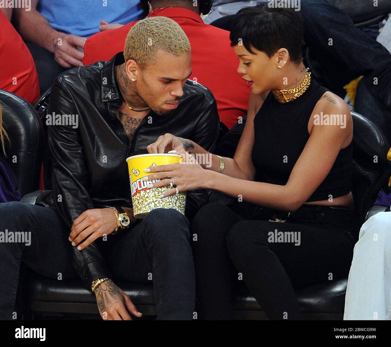 Rihanna, Chris Brown laughing together at LA Lakers NBA game, December ...