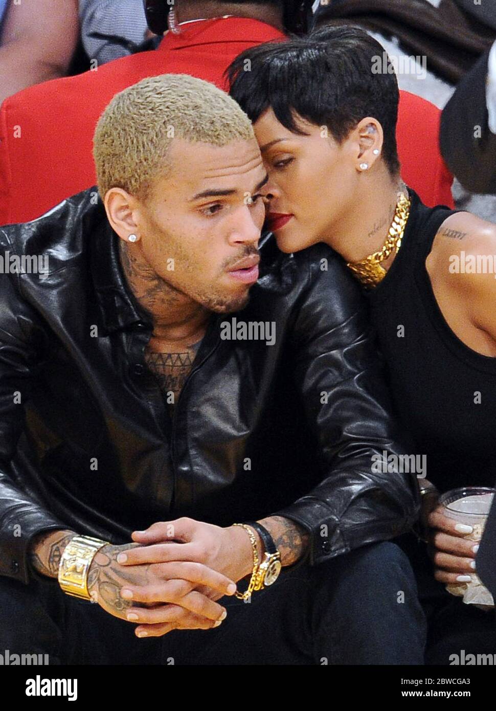 Rihanna, Chris Brown laughing together at LA Lakers NBA game, December ...