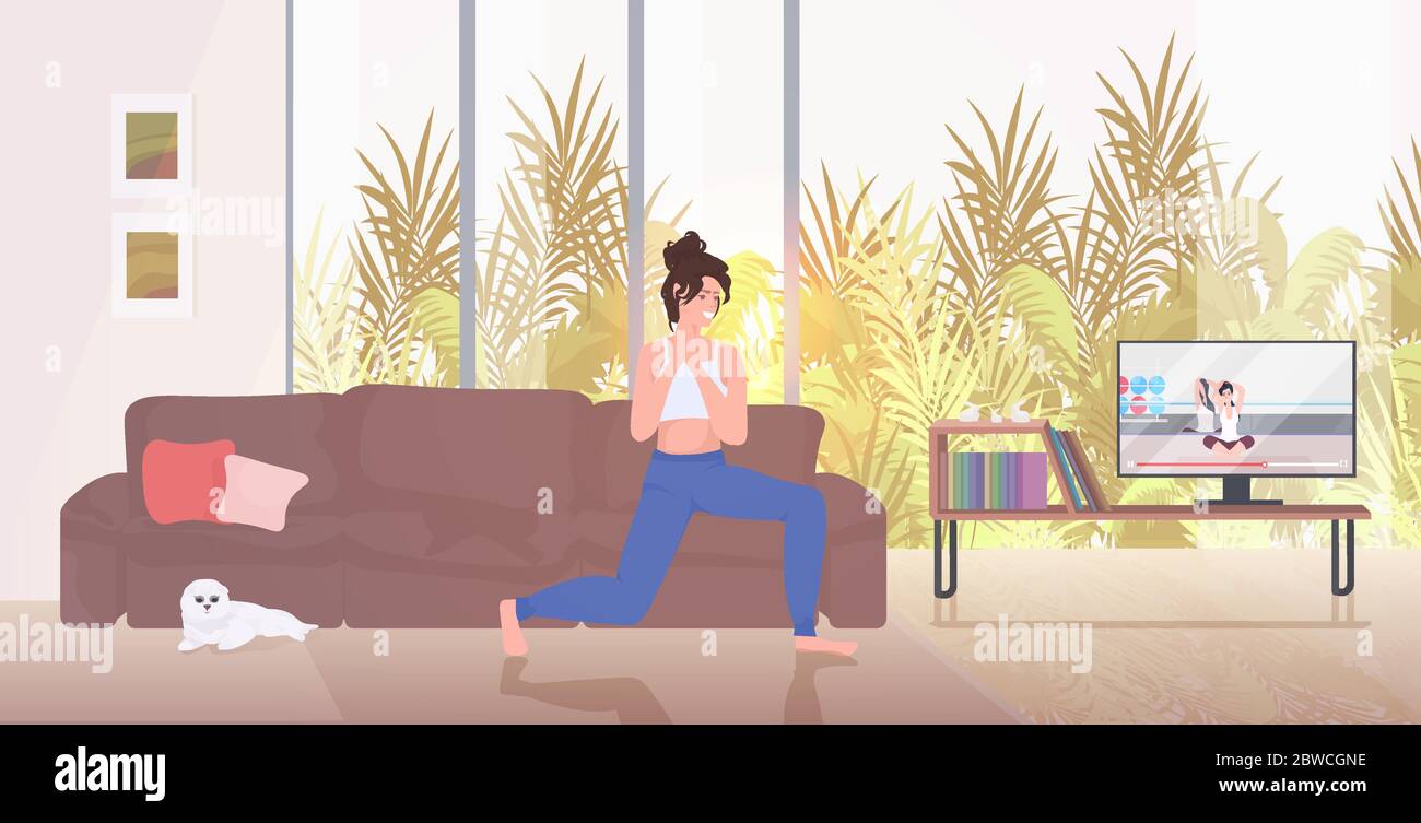 woman doing fitness exercises during tv show healthy lifestyle concept ...