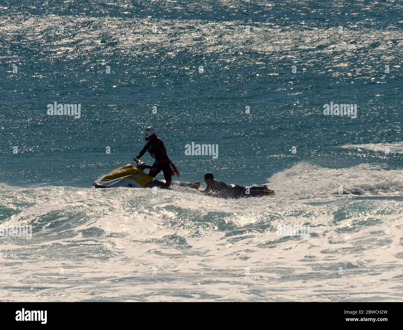 RNLI lifeguards rescue surfers at fistral beach one day after resuming ...