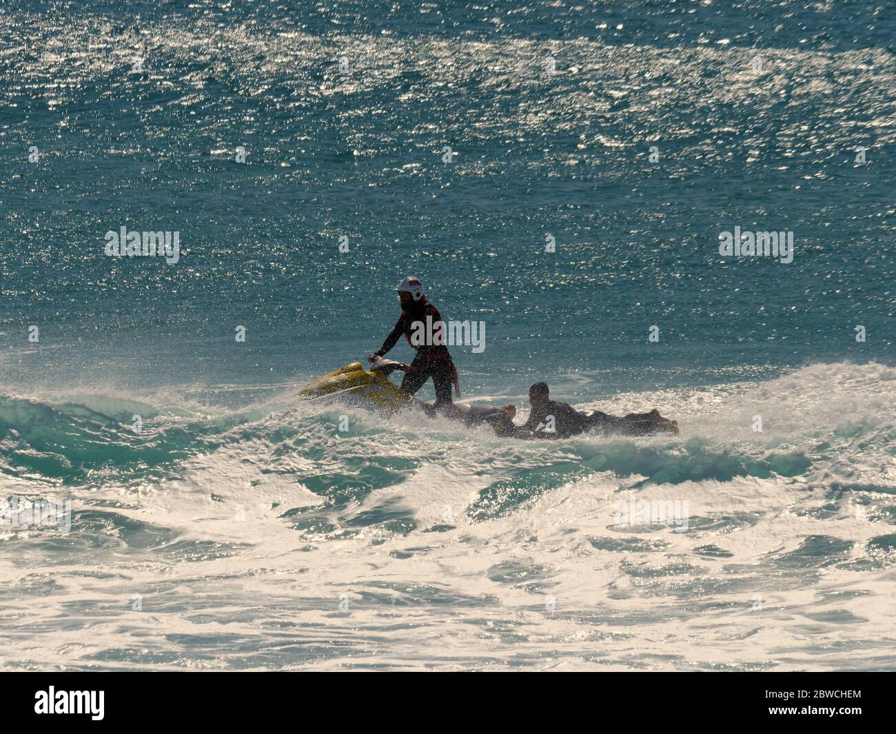 RNLI lifeguards rescue surfers at fistral beach one day after resuming ...