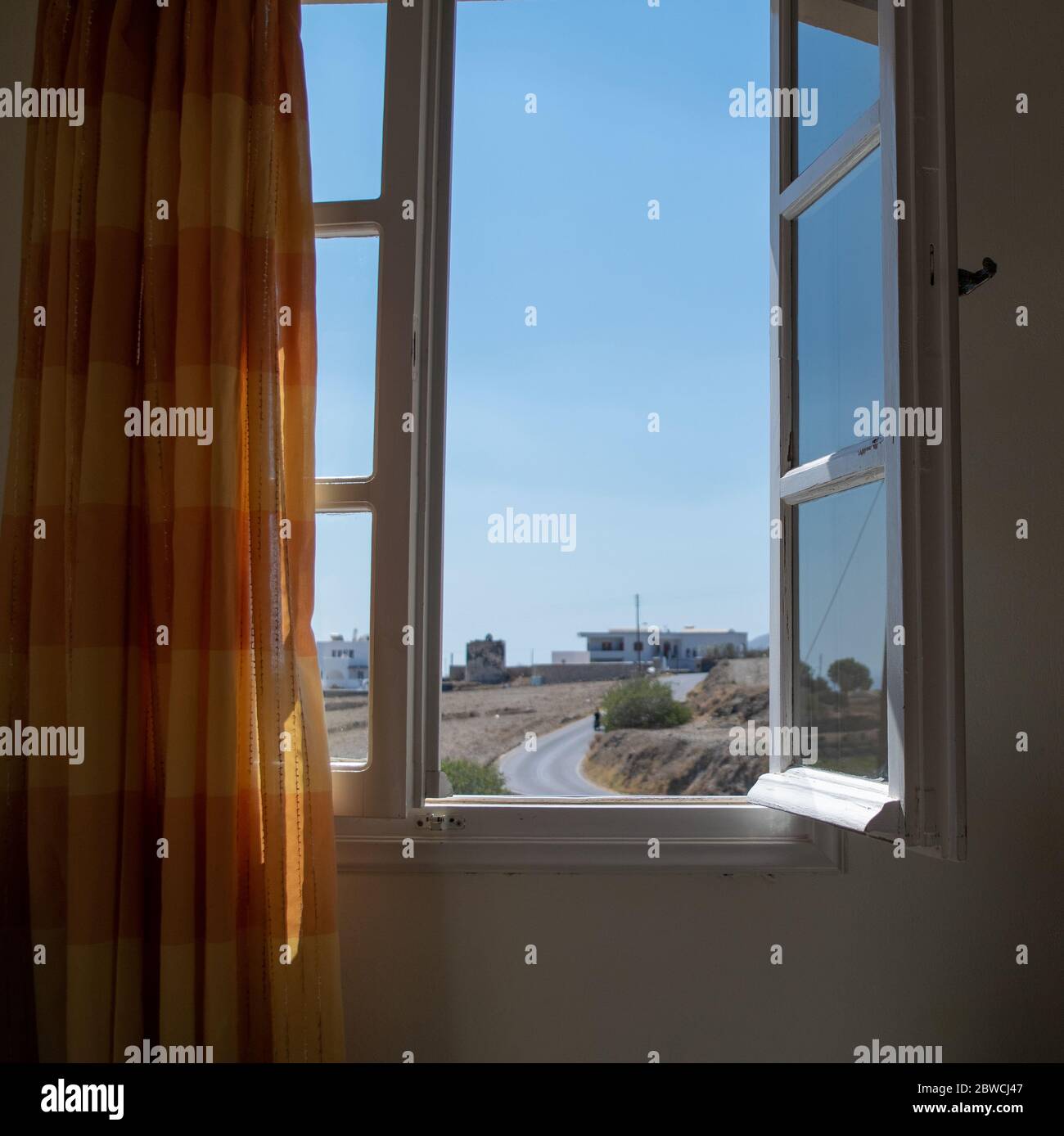 Inside view from inside a window of a road at Santorini island Stock ...