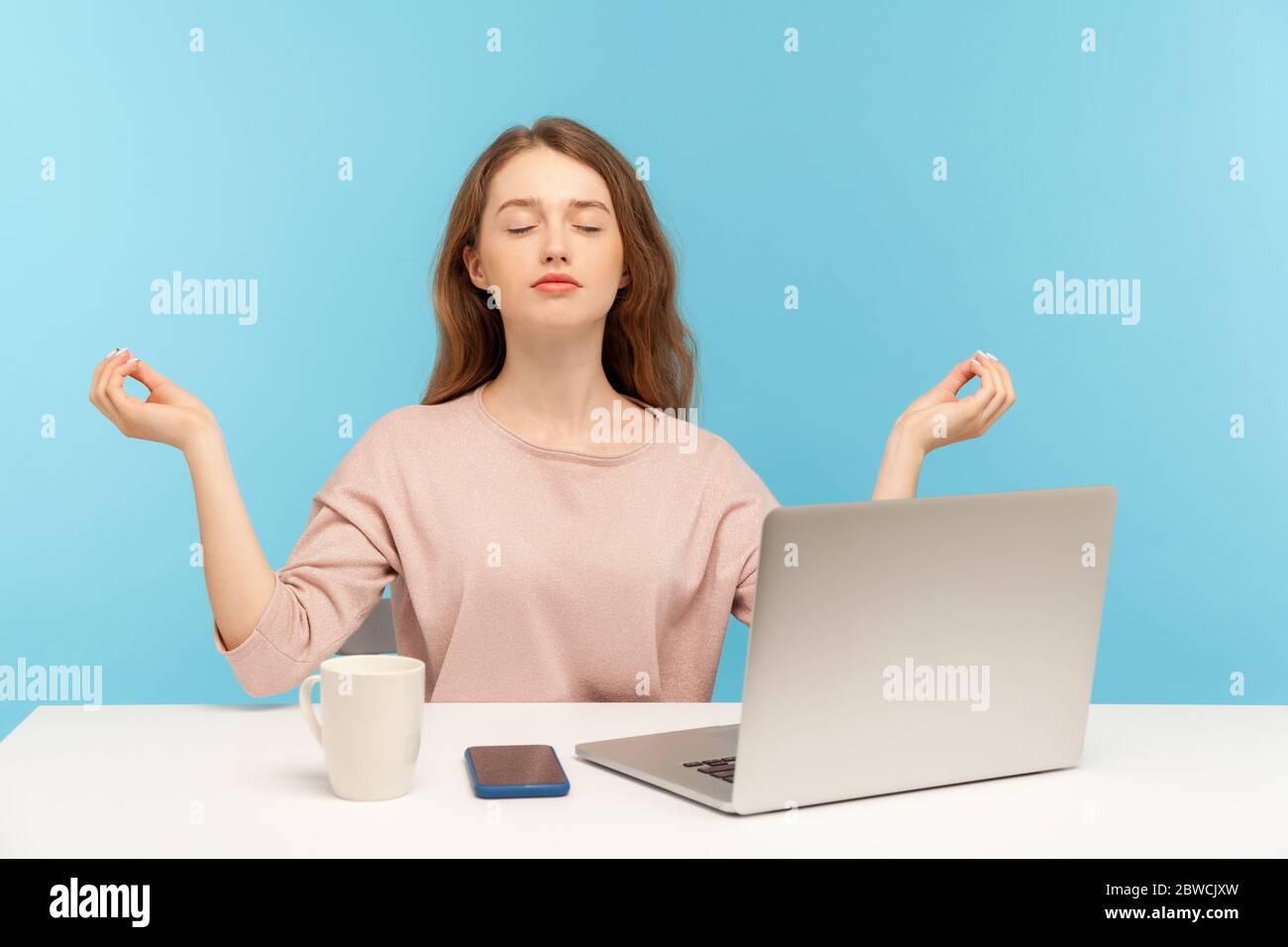 Peaceful mind, break at work. Calm woman employee sitting at workplace ...