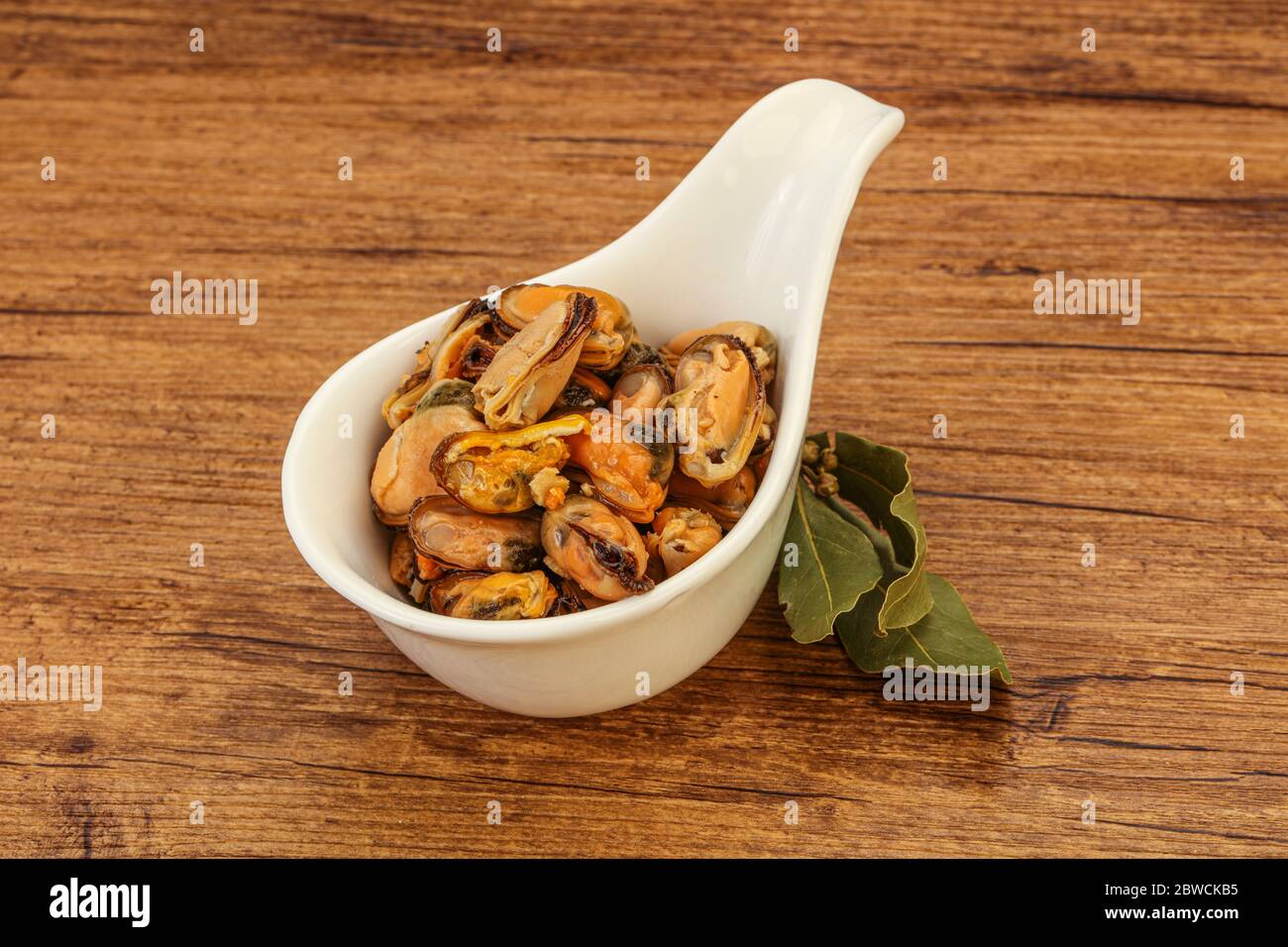 Pickled mussels with spices in the bowl Stock Photo - Alamy