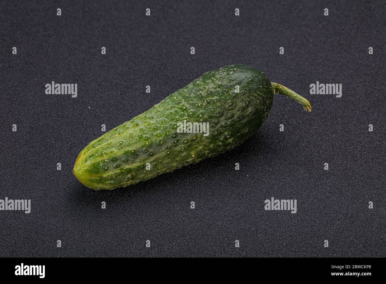 Green ripe fresh one cucumber over background Stock Photo - Alamy