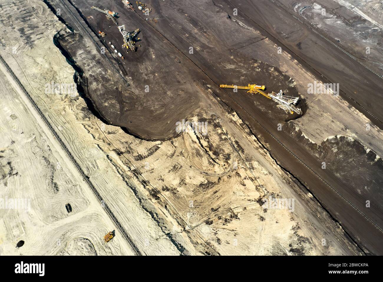 Aerial shoot of quarry with heavy bucket wheel excavators mining a coal ...
