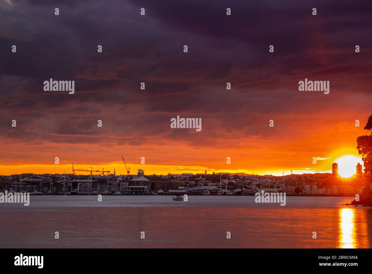 Auckland city skyline at sunset after heavy storm with city center and ...