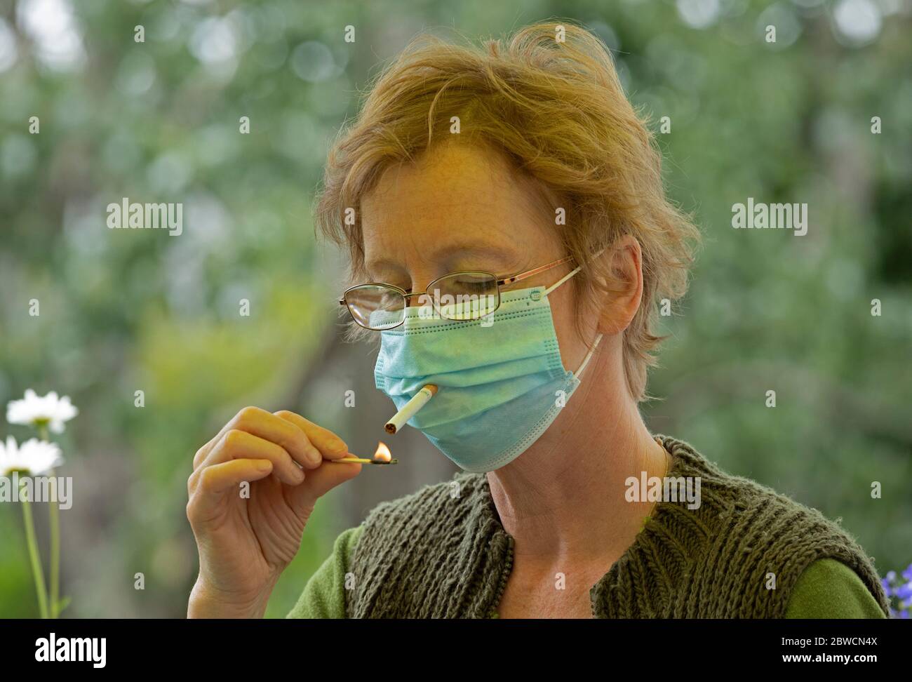 Woman in glasses smoking cigarette hi-res stock photography and images ...