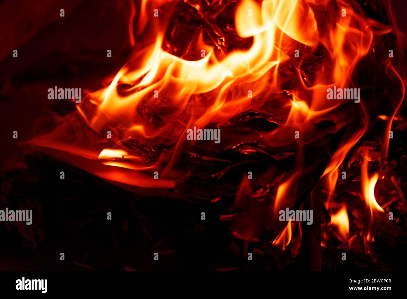 Concept for the destruction of confidential documents. Burning pages of ...